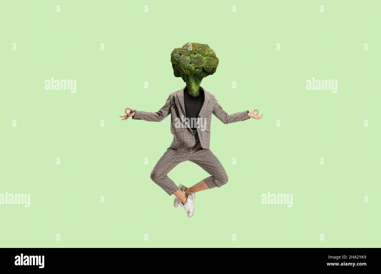 Composition with woman headed of green broccoli sitting in lotus ...