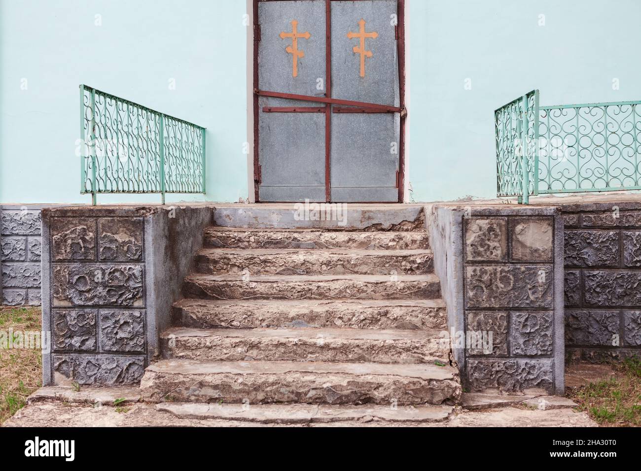 Staircase to church entrance . Religious cross on the door Stock Photo ...