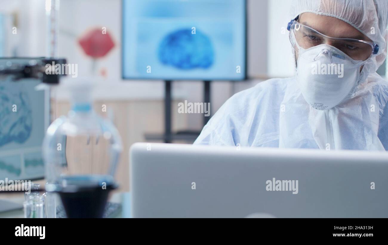 Chemist researcher doctor analyzing brain activity typing medical ...