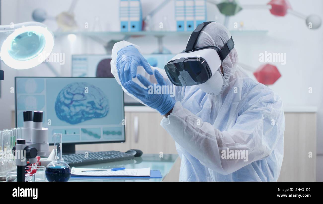 Scientist researcher doctor wearing virtual reality headset during ...