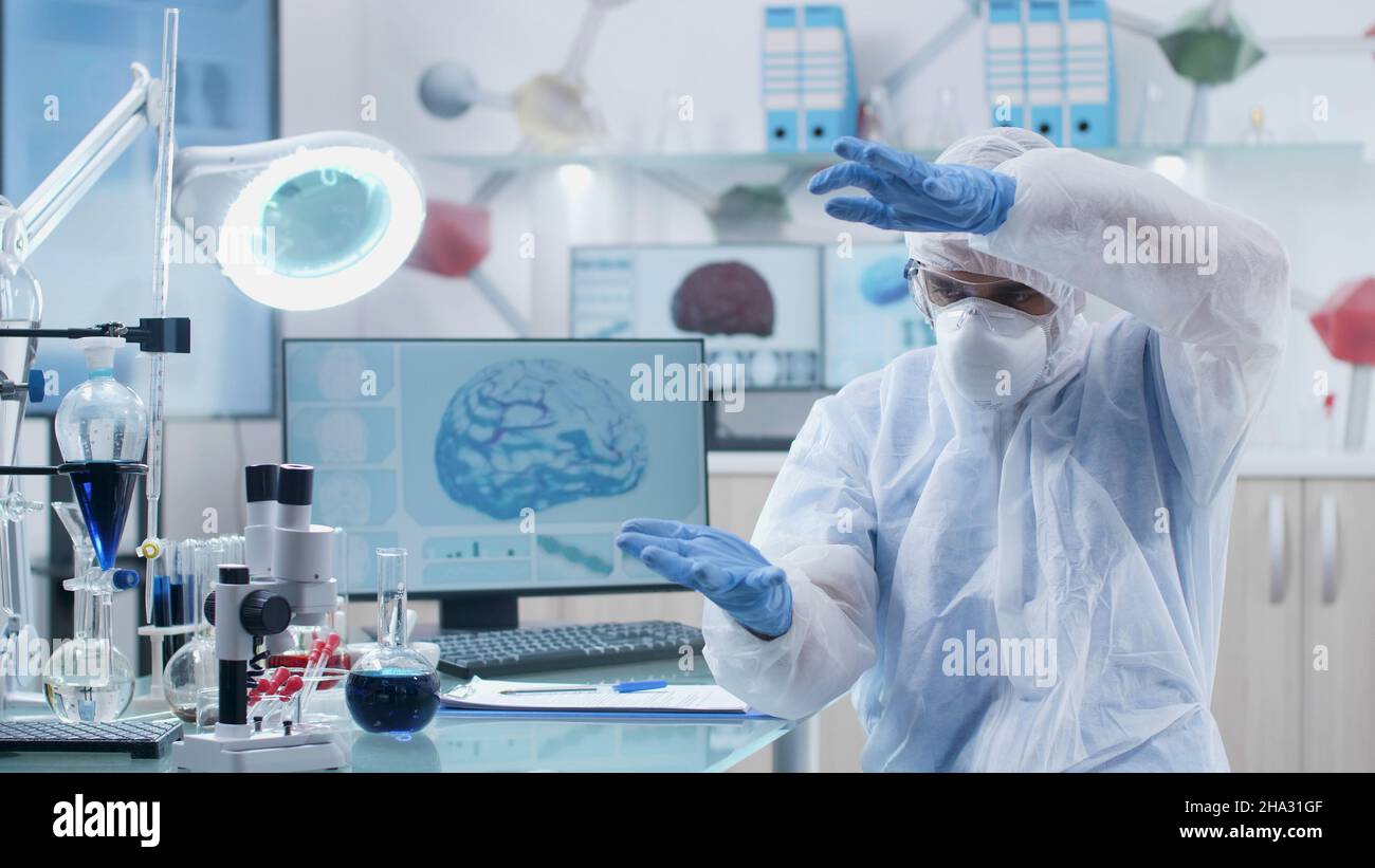 Scientist microbiologist doctor wearing virtual reality googles during ...