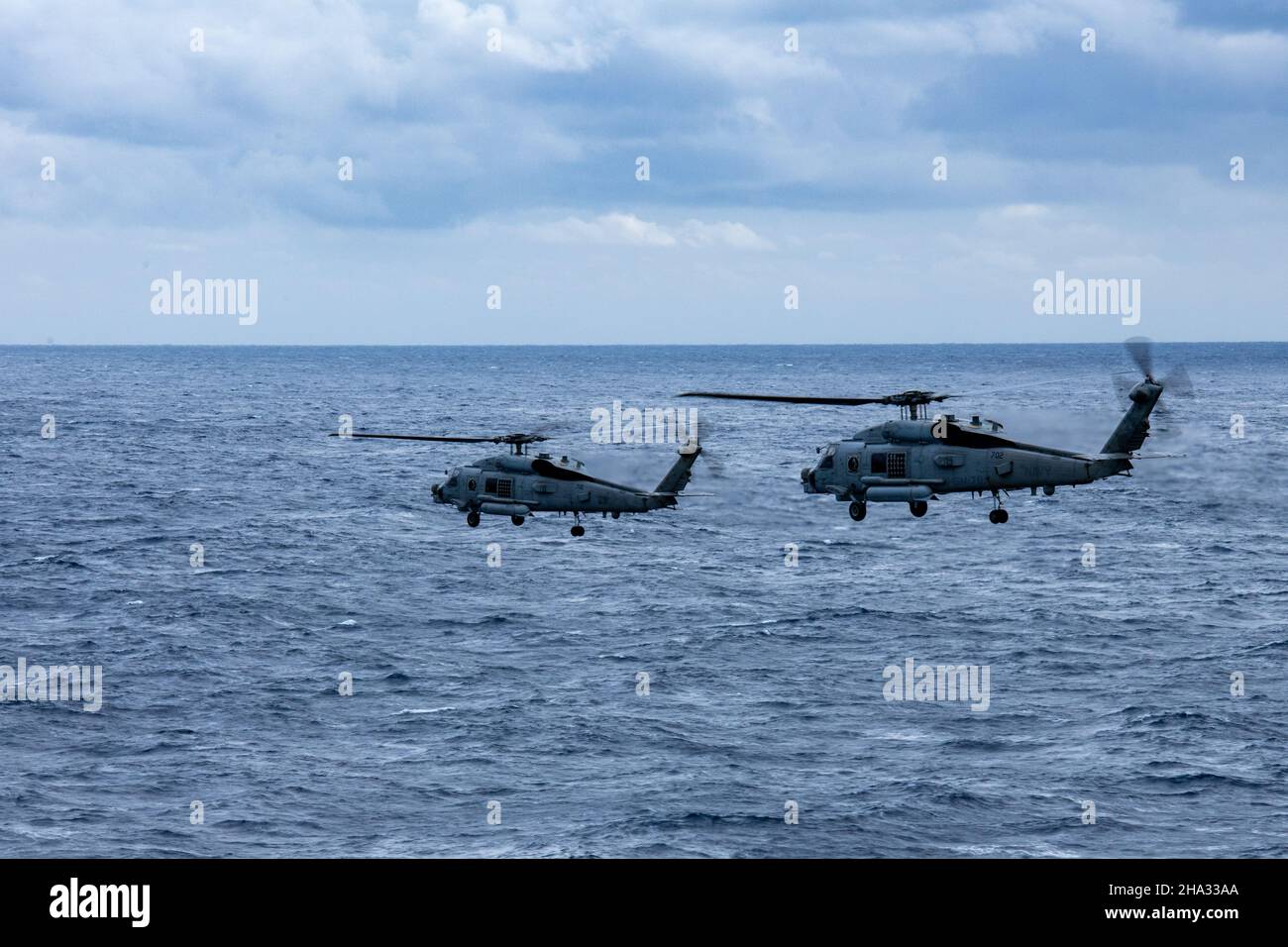 211129-N-BC658-1222 PHILIPPINE SEA (Nov. 29, 2021) Two MH-60R Sea Hawks ...