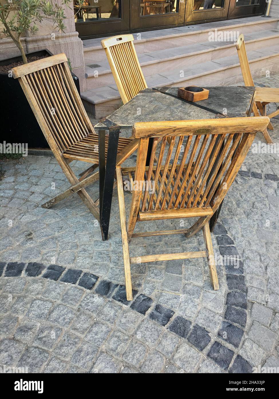 Retro style cafe outdoor with concrete wall Stock Photo - Alamy