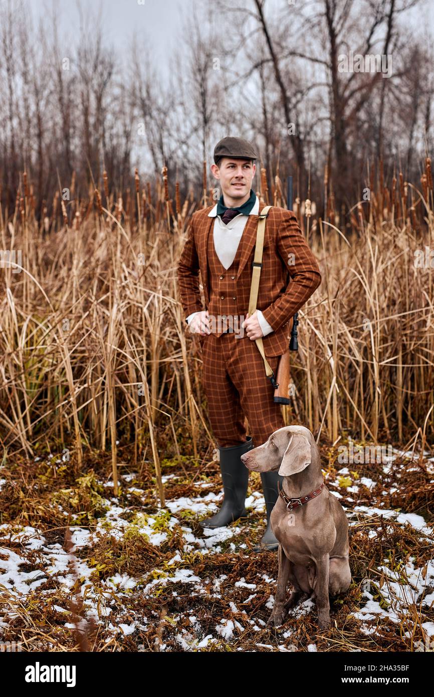 hunter in forest. caucasian Man holding shotgun. Hunter man. Hunting ...