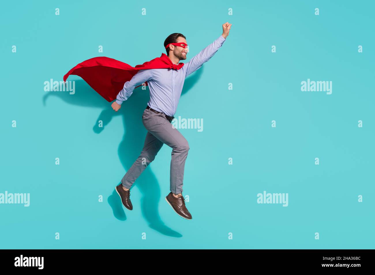 Photo of superhero clerk raise hand jump prepare save world wear cape ...