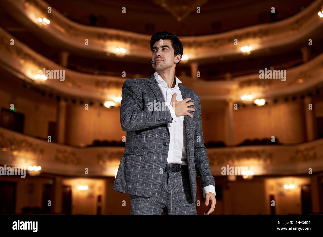 young caucasian european actor performing a monologue in theater to ...