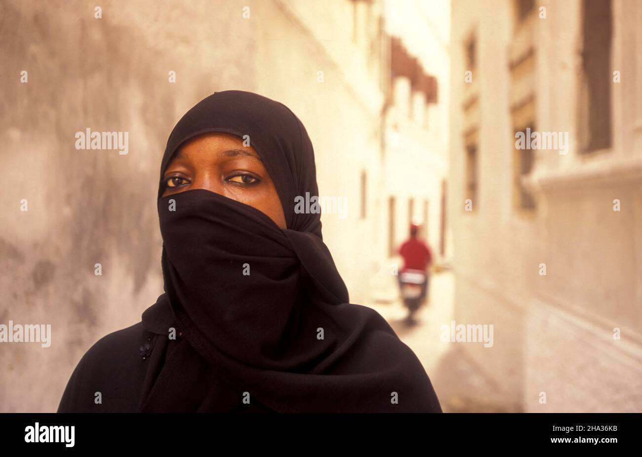 a local muslim Women in the Old Town of Stone Town on the Island of ...
