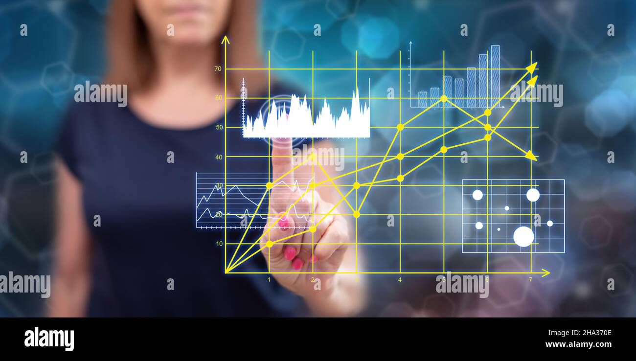 Woman touching business charts on a touch screen with her finger Stock ...