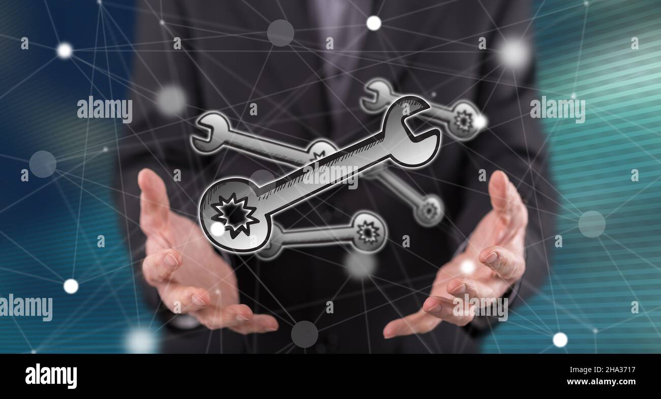 Maintenance service concept above the hands of a man in background ...