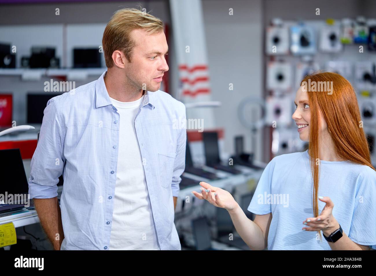 Woman electronics appliances store hi-res stock photography and images ...