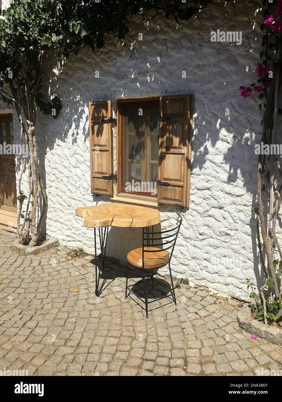 Retro style cafe outdoor with concrete wall Stock Photo - Alamy