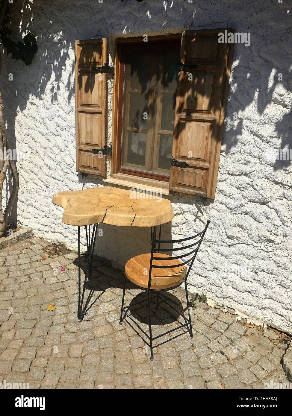 Retro style cafe outdoor with concrete wall Stock Photo - Alamy