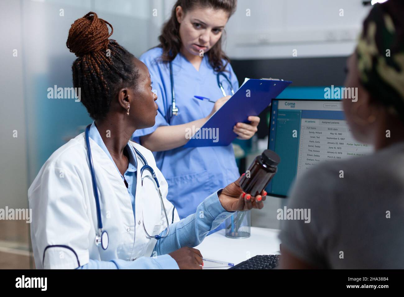 African american practitioner doctor explaining sickness symptoms to ...