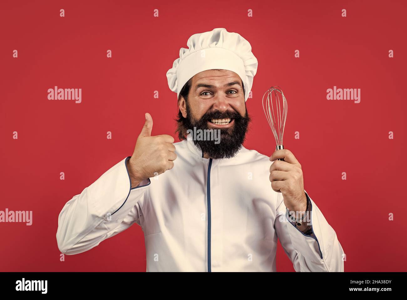 skilled baker use kitchen utensils for cooking. male chef in hat ...