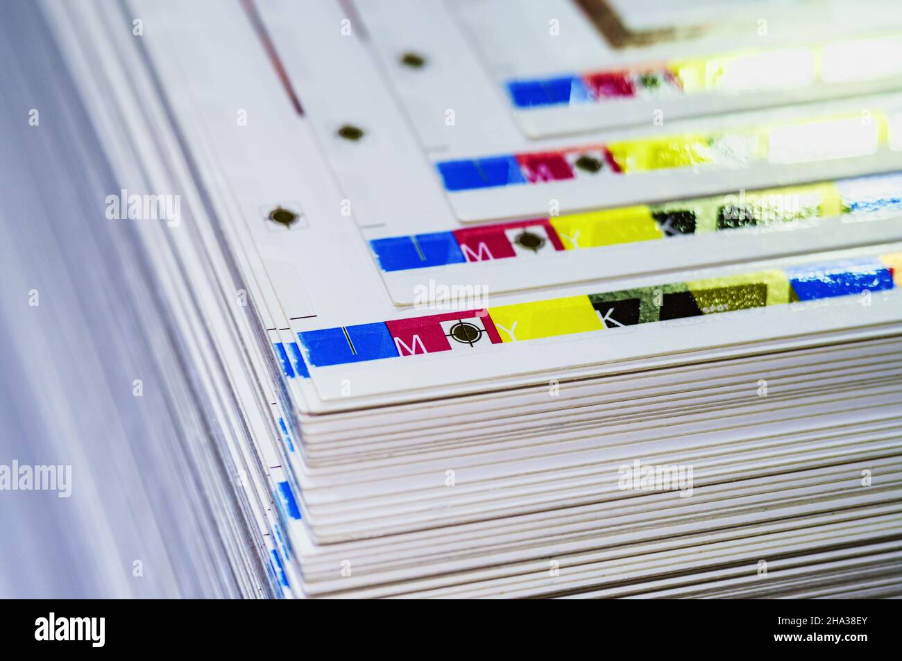 Offset printing. Sheets of printed products. CMYK press. Paper at the ...