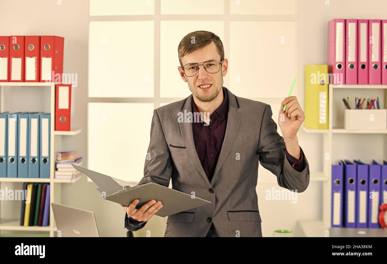 Man in jacket folder successful manager work with documents, inspecting ...