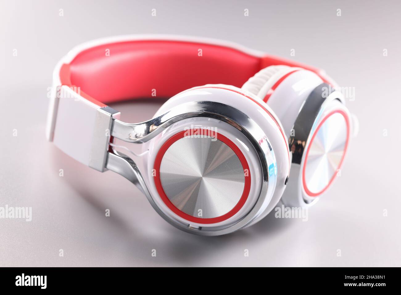 White red wireless headphones on gray background. Choosing headphones ...