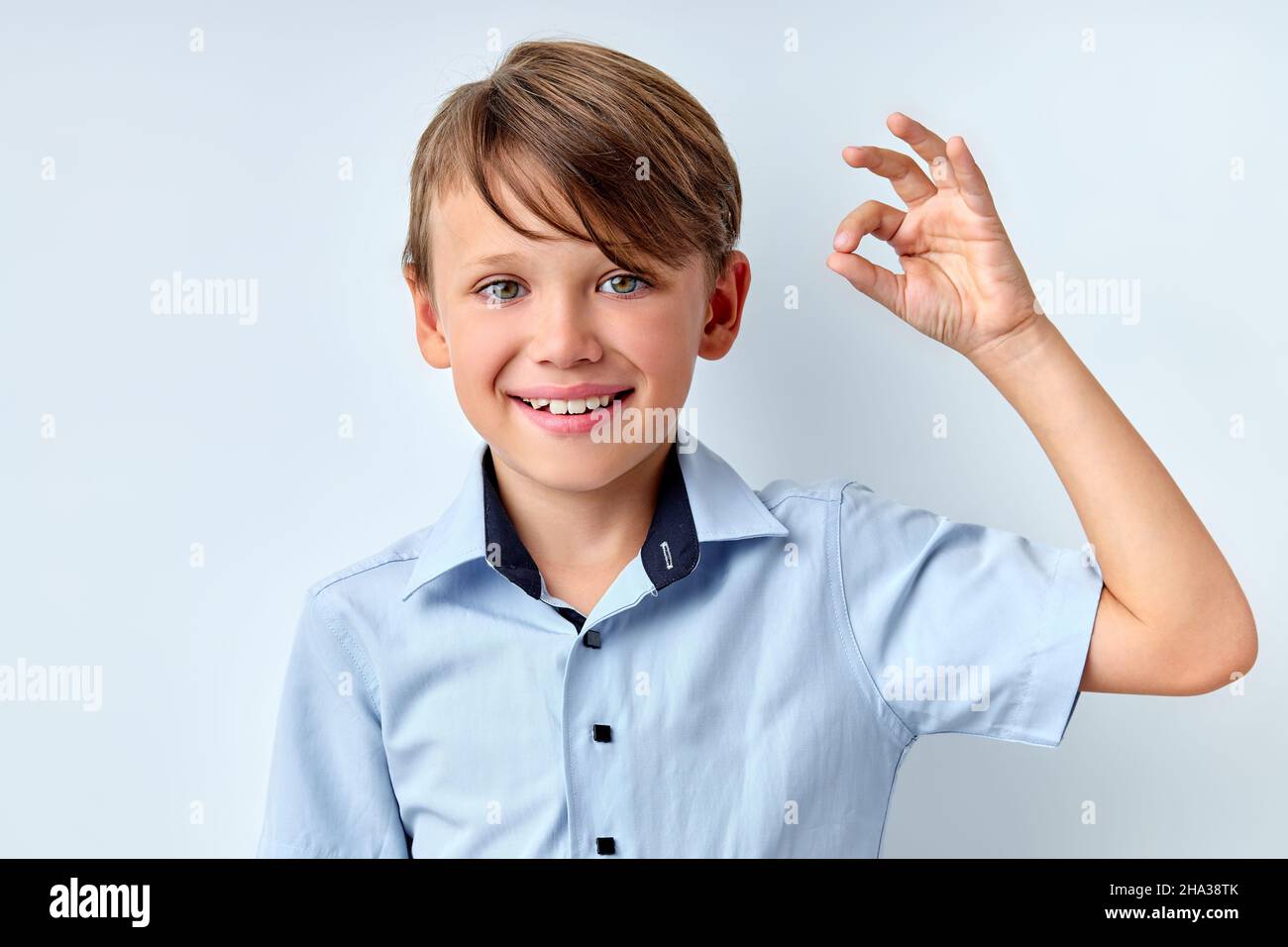 it's OK. Happy child boy showing ok gesture, isolated on white studio ...