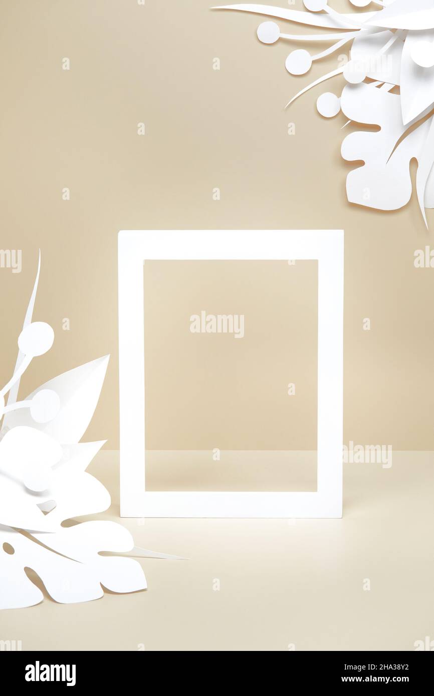 3d beige scene with frame and paper cut leaves Stock Photo - Alamy
