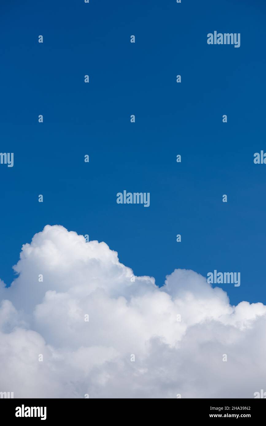 Fluffy white cloud on deep blue sky Stock Photo - Alamy