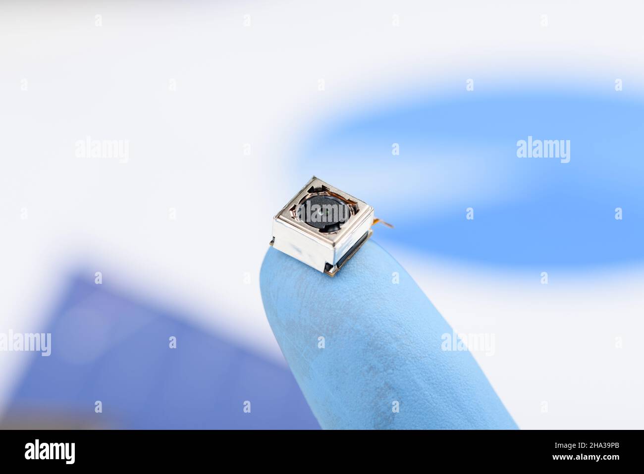 Smartphone camera module on a fingertip Stock Photo - Alamy