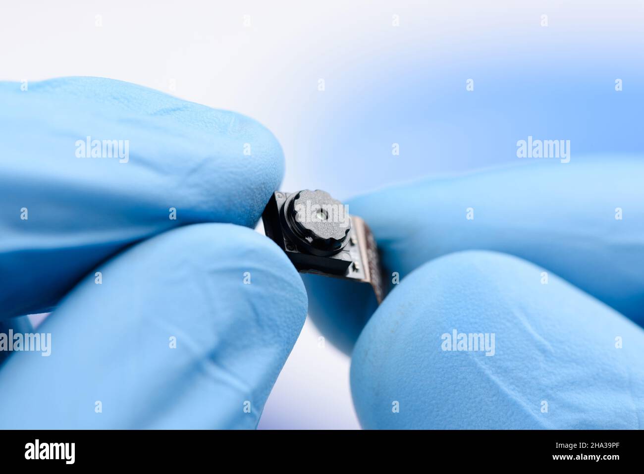 Smartphone camera module in scientist hands. New sensor with high ...
