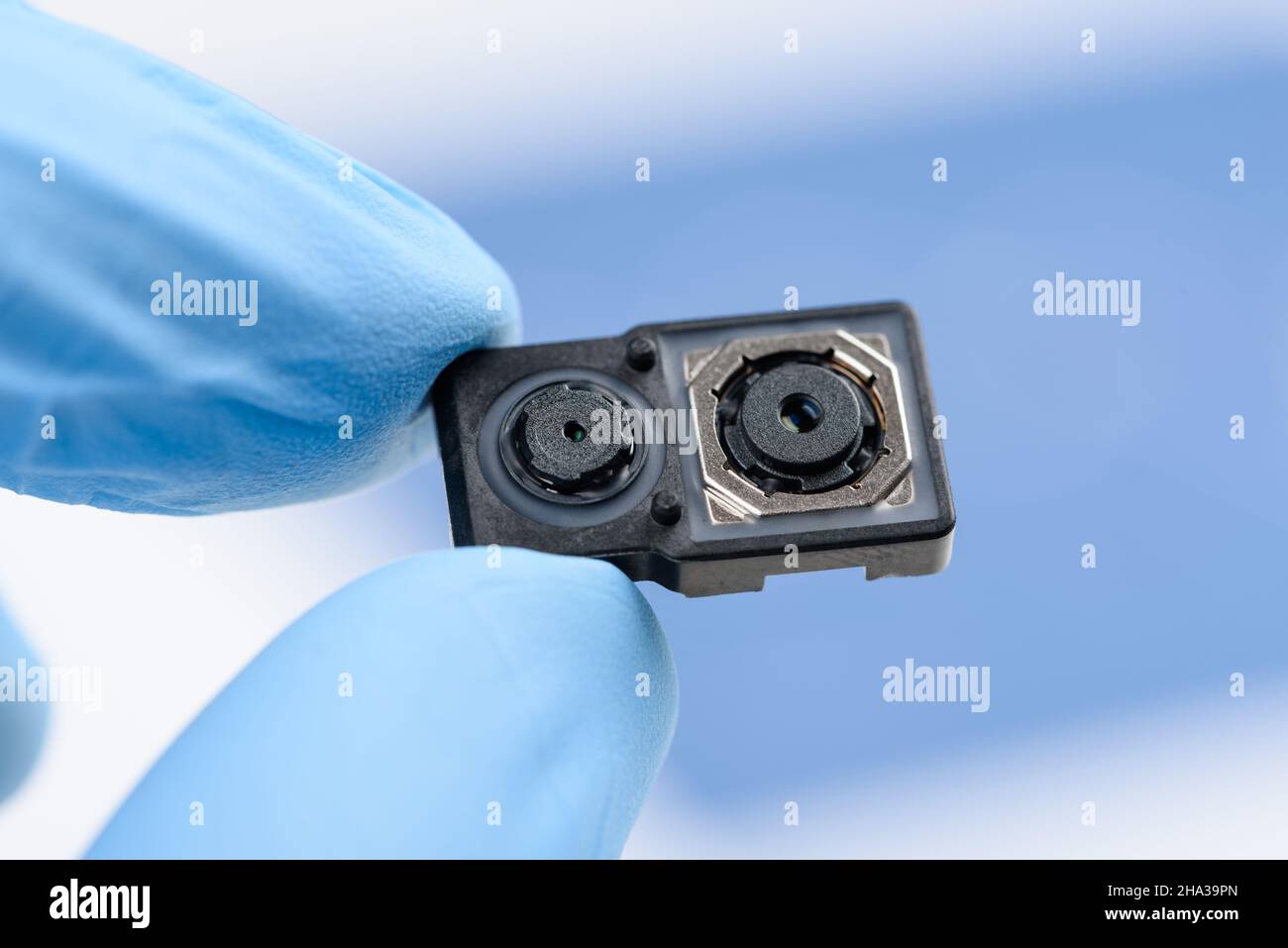 Smartphone dual camera system module in scientist hands Stock Photo - Alamy