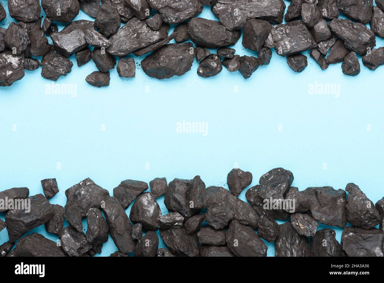 Black coal frame border isolated on blue background top view Stock ...