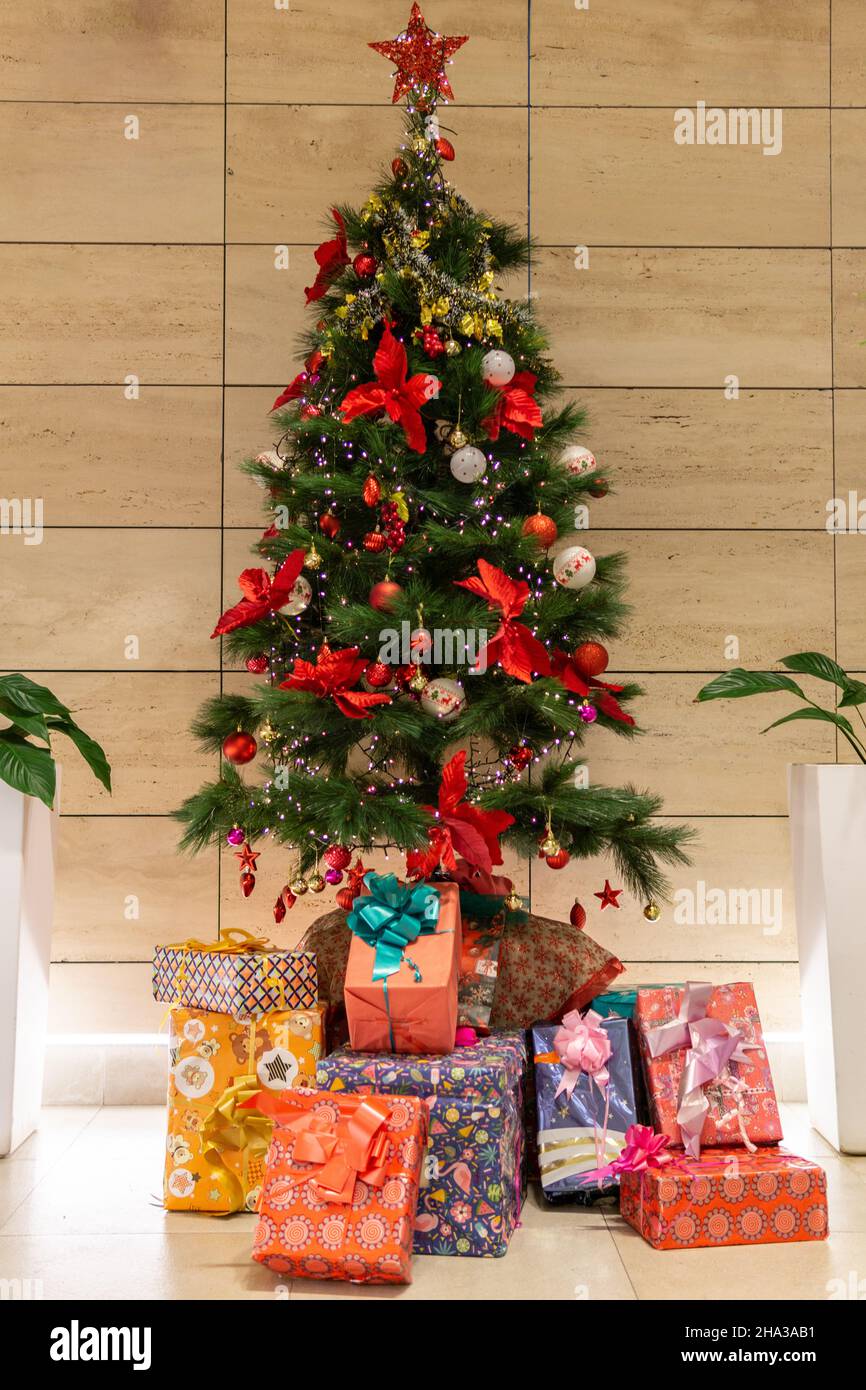 Christmas scene with gifts under the tree Stock Photo - Alamy