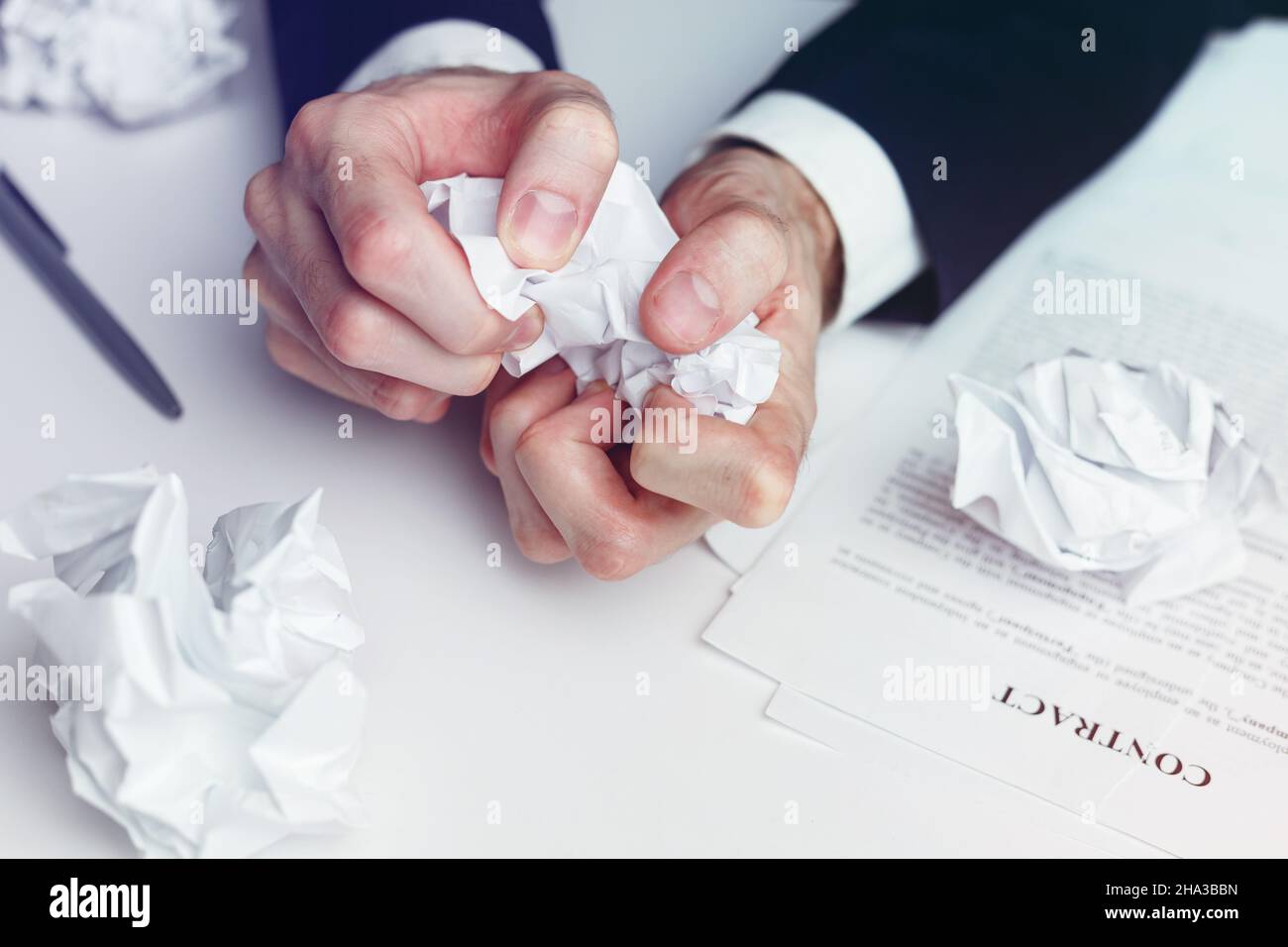 Stressed businessman crumple paper contract and documents - failed deal ...