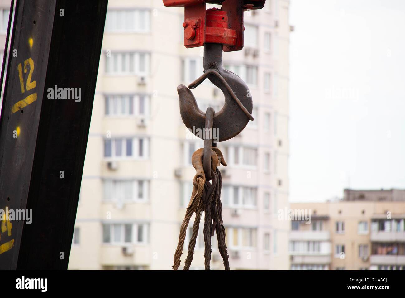 Crane hook. Tower Crane Hoist Rope against the blue sky and new ...