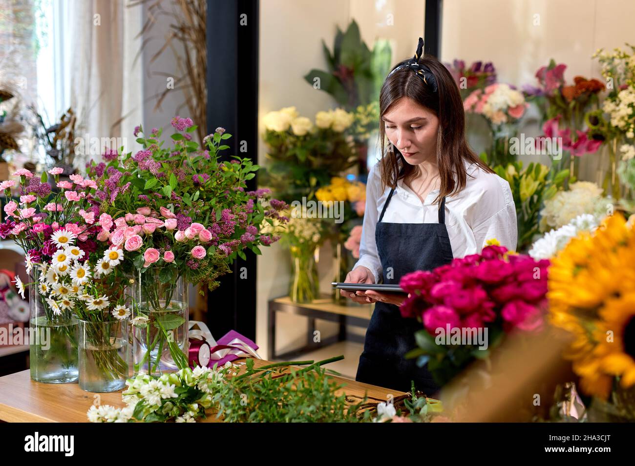 business, technology, sale and floristry and concept. florist woman ...