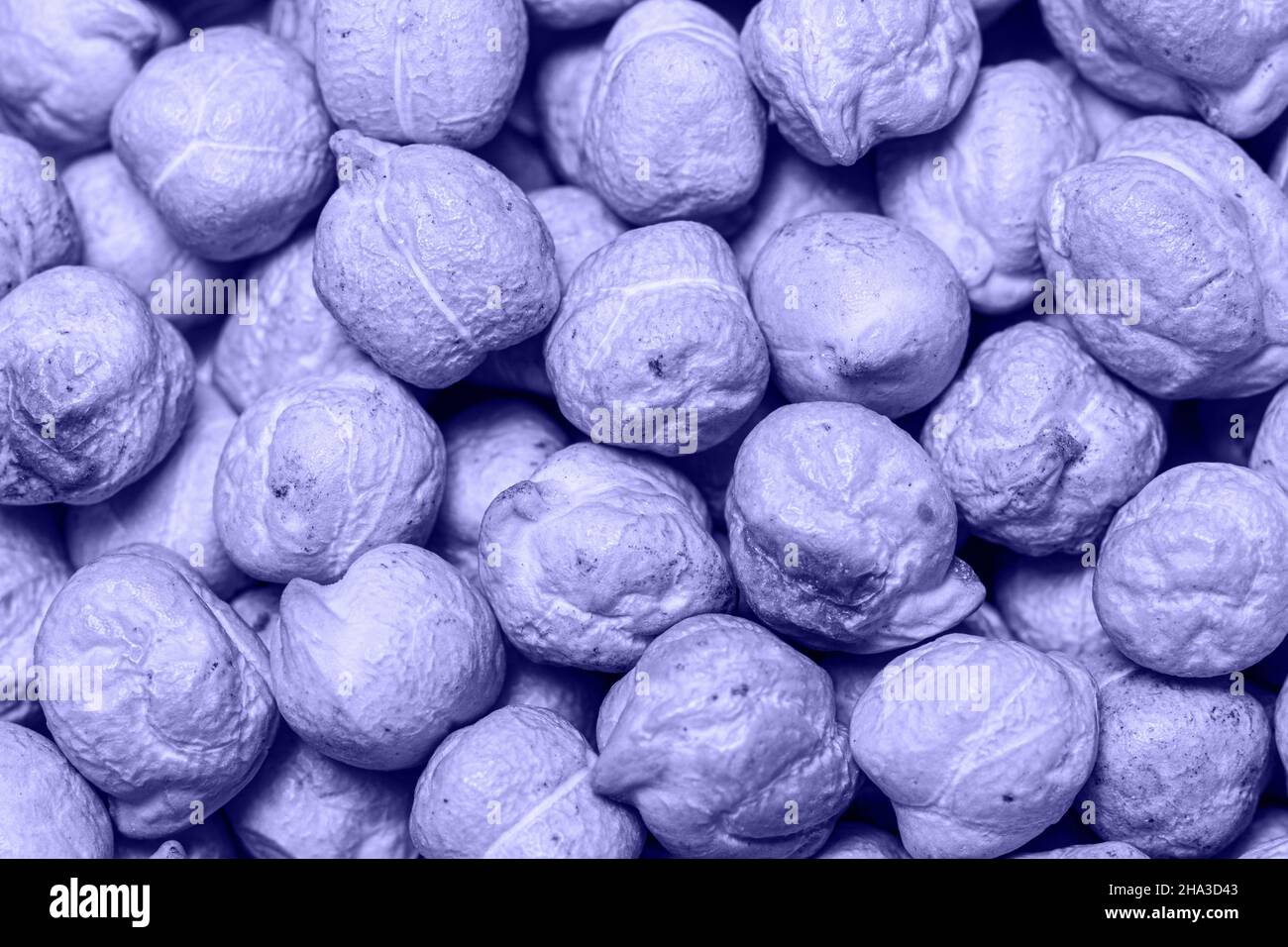 Macro photo of chickpeas, top view. Color of the Year 2022 - Very Peri ...