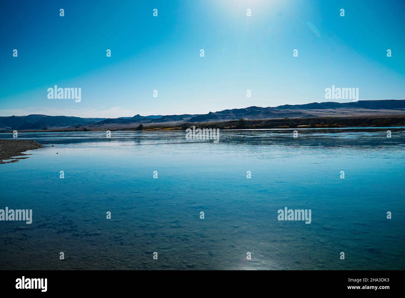 A beautiful autumn landscape, a lake with clear water in a hilly area ...