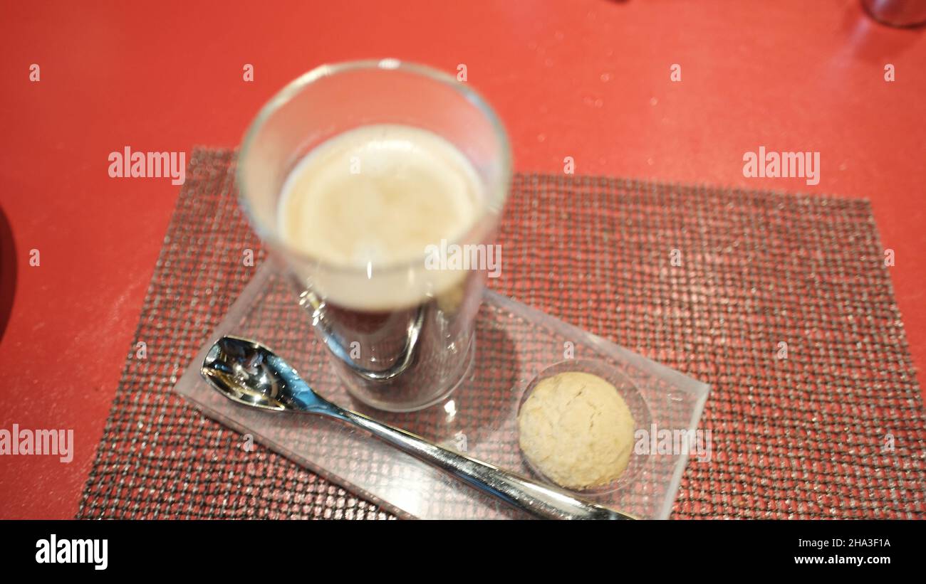 Coffee and a Biscuit on a Tray on a Red Table W Bangkok Stock Photo - Alamy