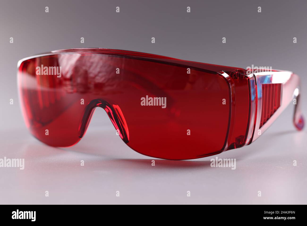 UV protective goggles on gray background. Laser eye protection concept ...