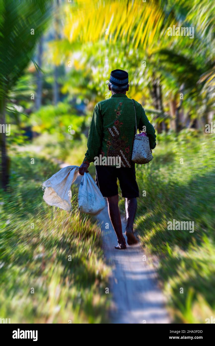 Man walking on path on rural area Stock Photo - Alamy