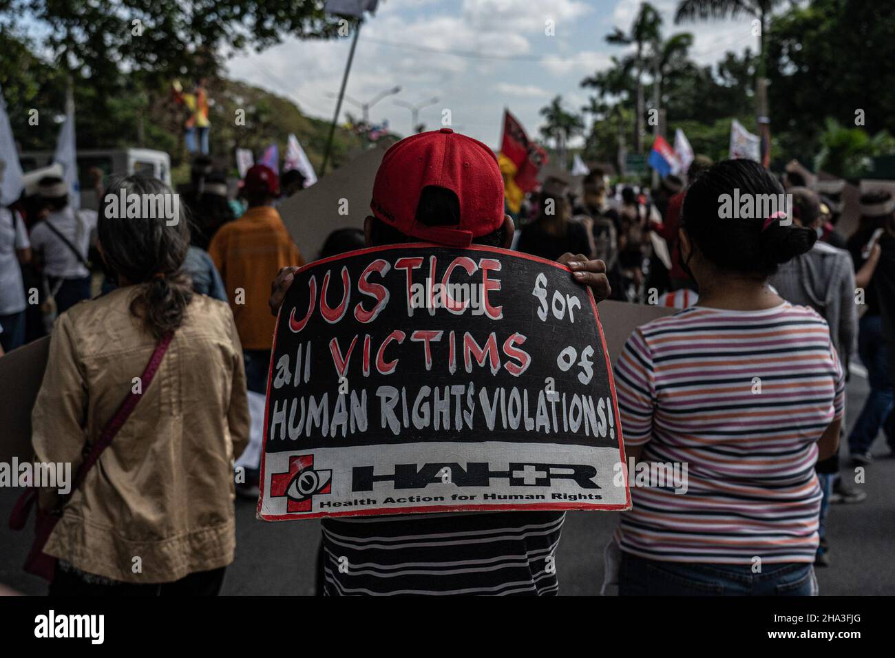 Metro Manila, Philippines. 10th Dec, 2021. An activist holds a sign ...
