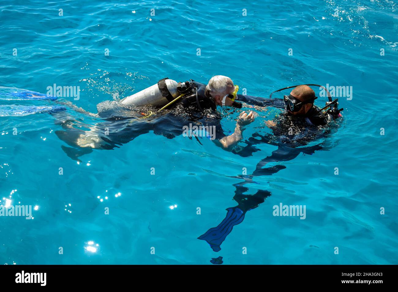 Learning process of scuba diving. Experienced instructor teaches ...