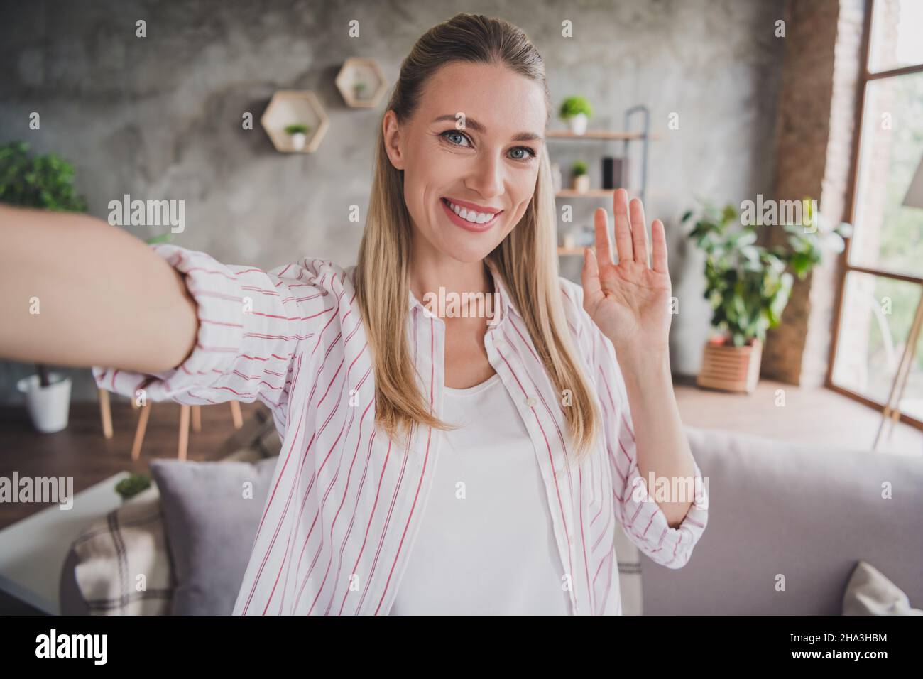 Photo of cheerful lovely woman good mood communication talk video use ...