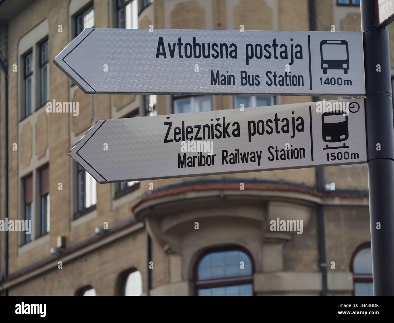 Road signs showing direction and the distance to reach the bus stop ...