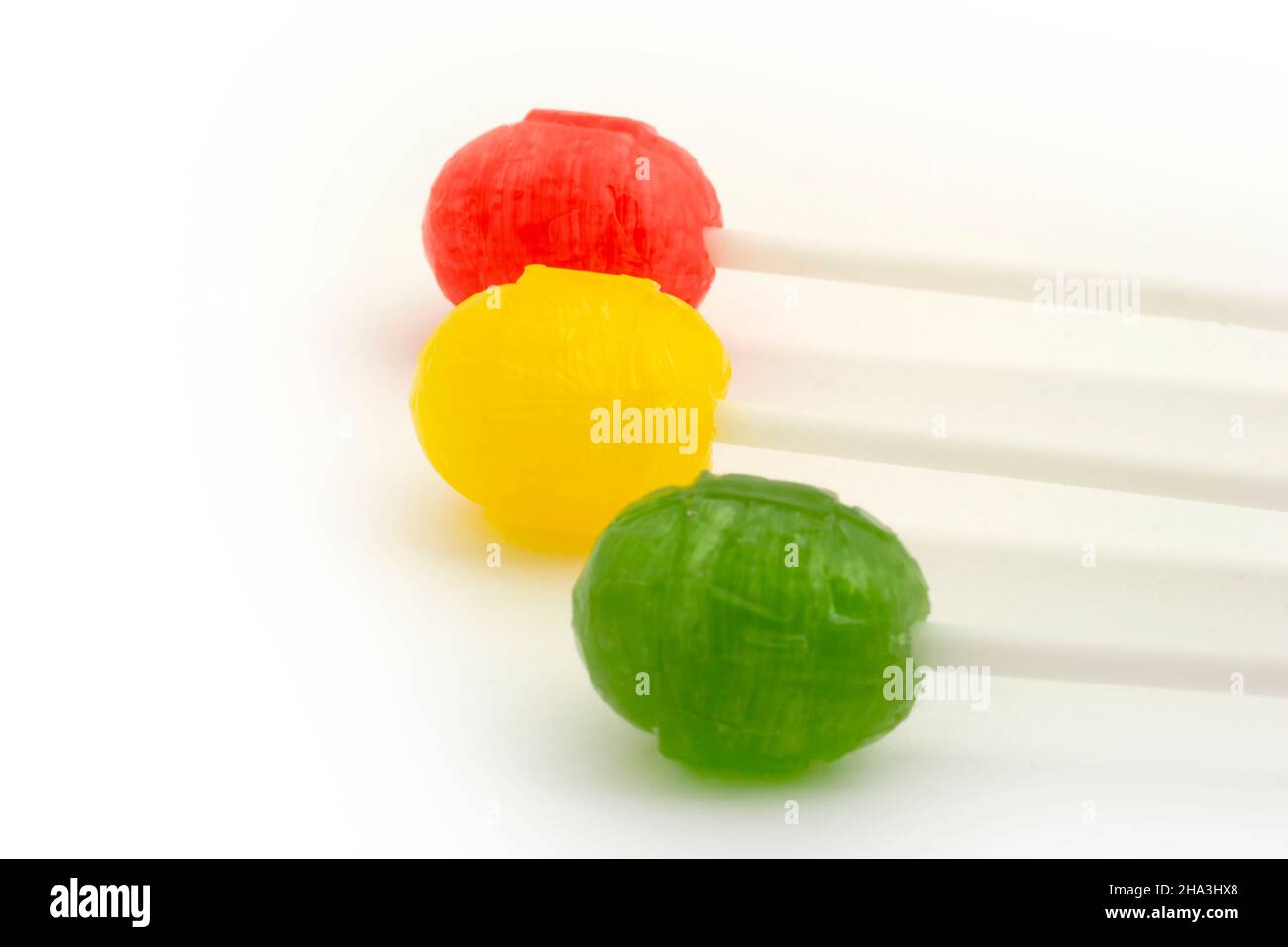 Three delicious lollipops isolated on white Stock Photo - Alamy
