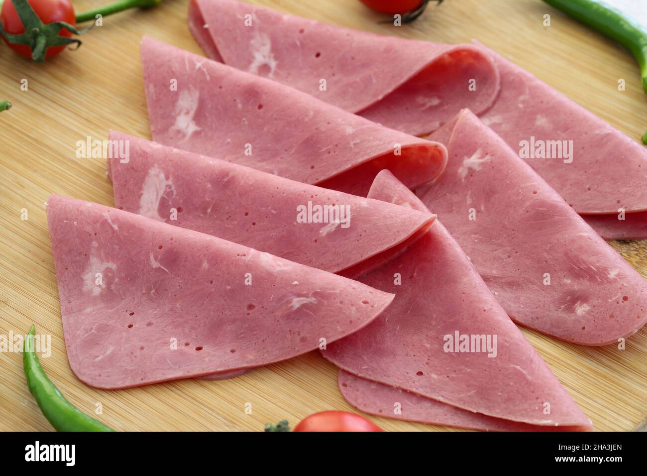 beef ham salami on a white background Stock Photo - Alamy