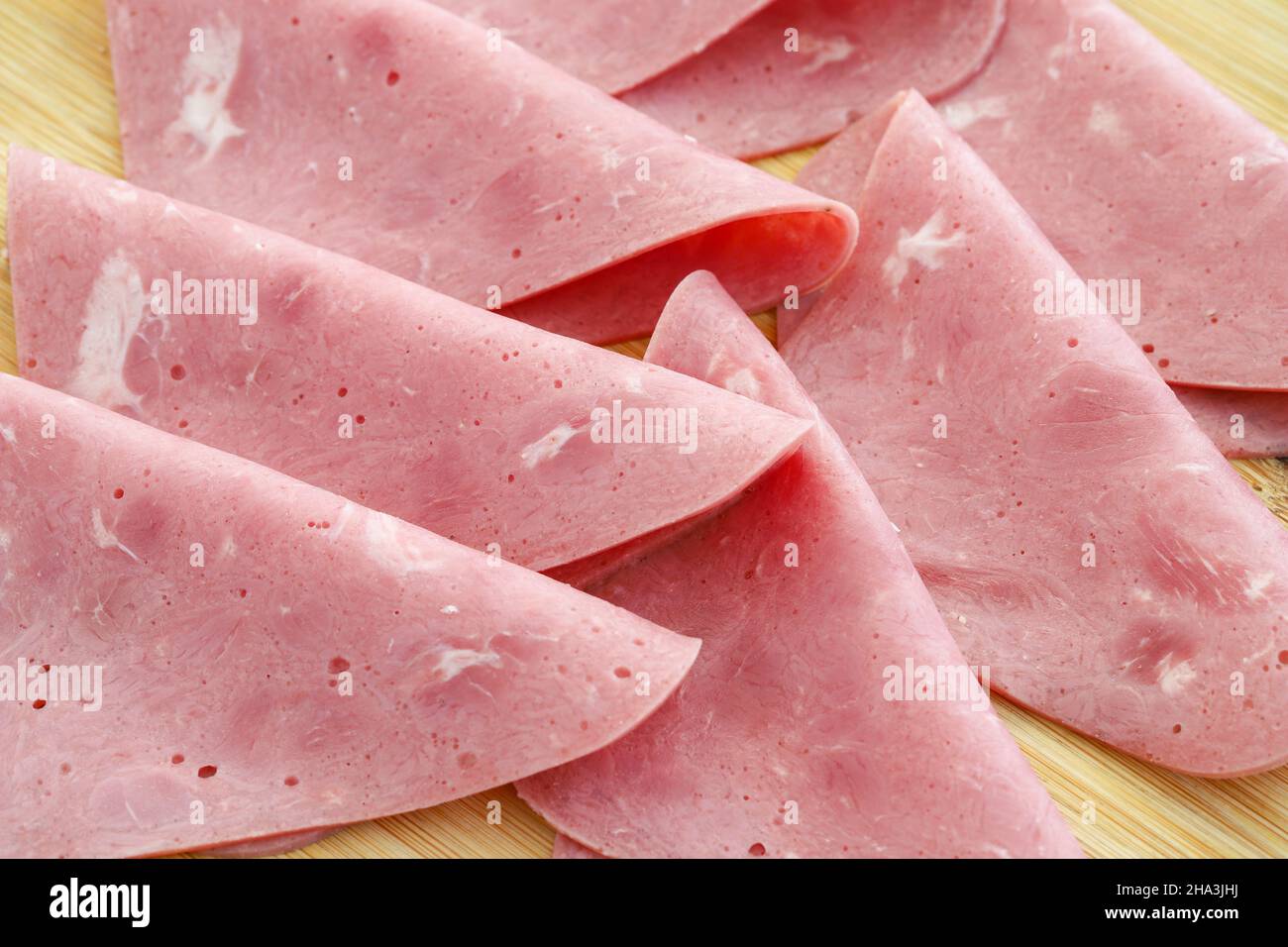 beef ham salami on a white background Stock Photo - Alamy