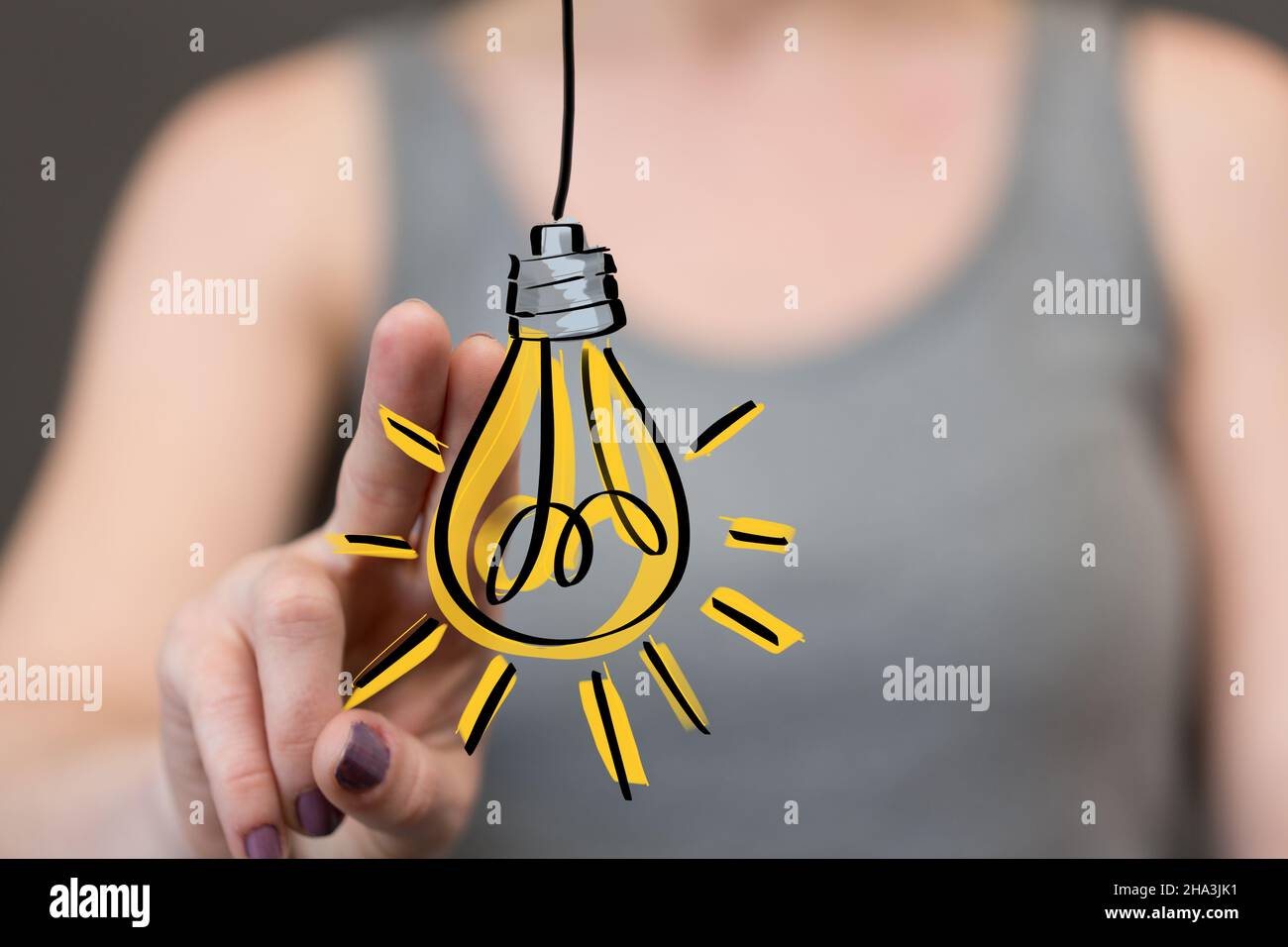 Woman's hand tapping on 3D rendered lightened lamp Stock Photo - Alamy