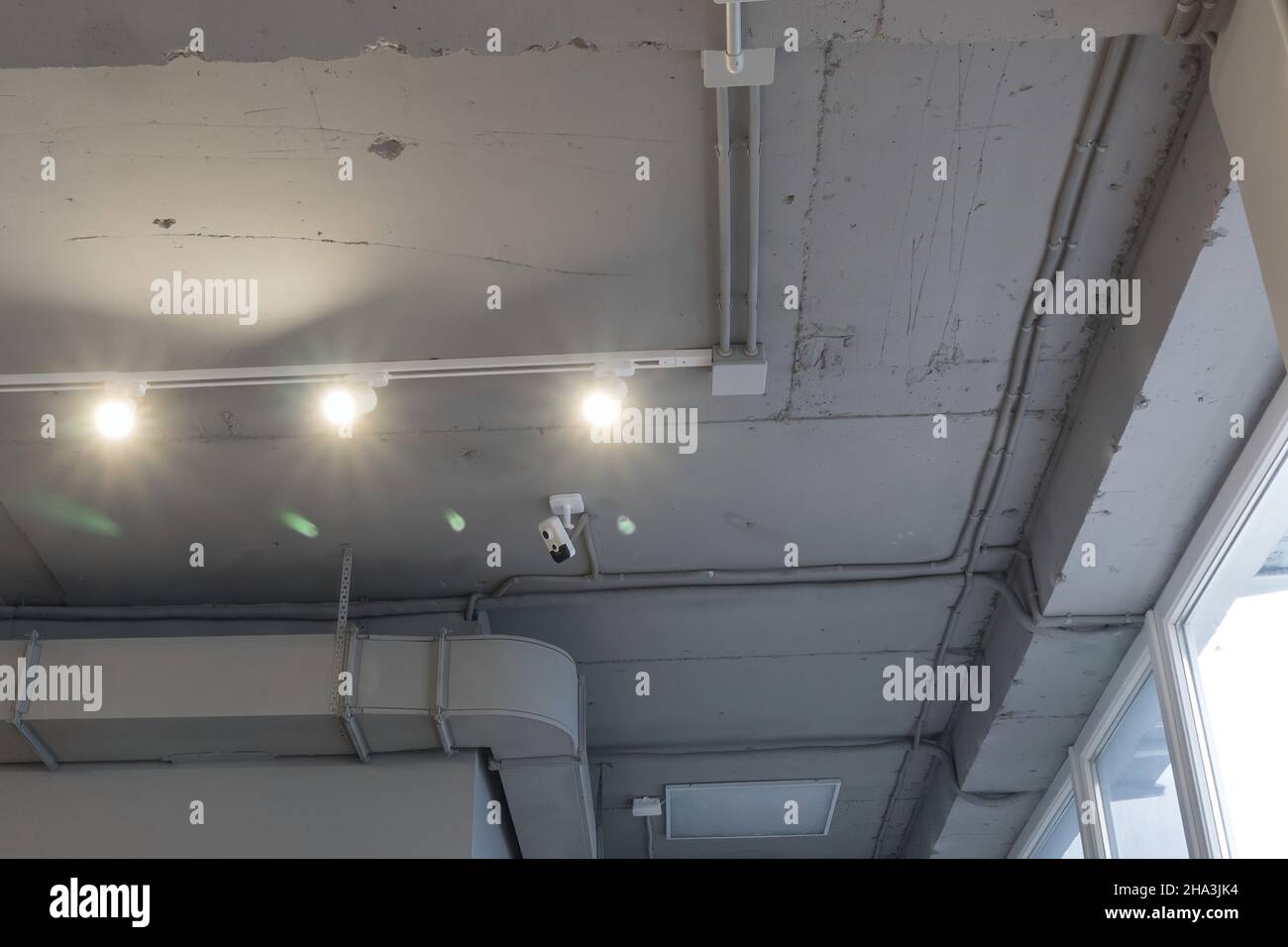 Abstract loft interior of concrete grey ceiling with air ventilation ...