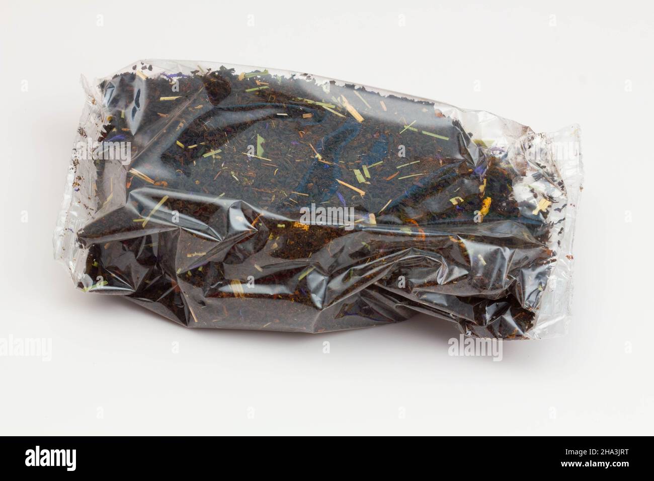 Black tea packaging on a white background. Long leaf tea with rose hips ...