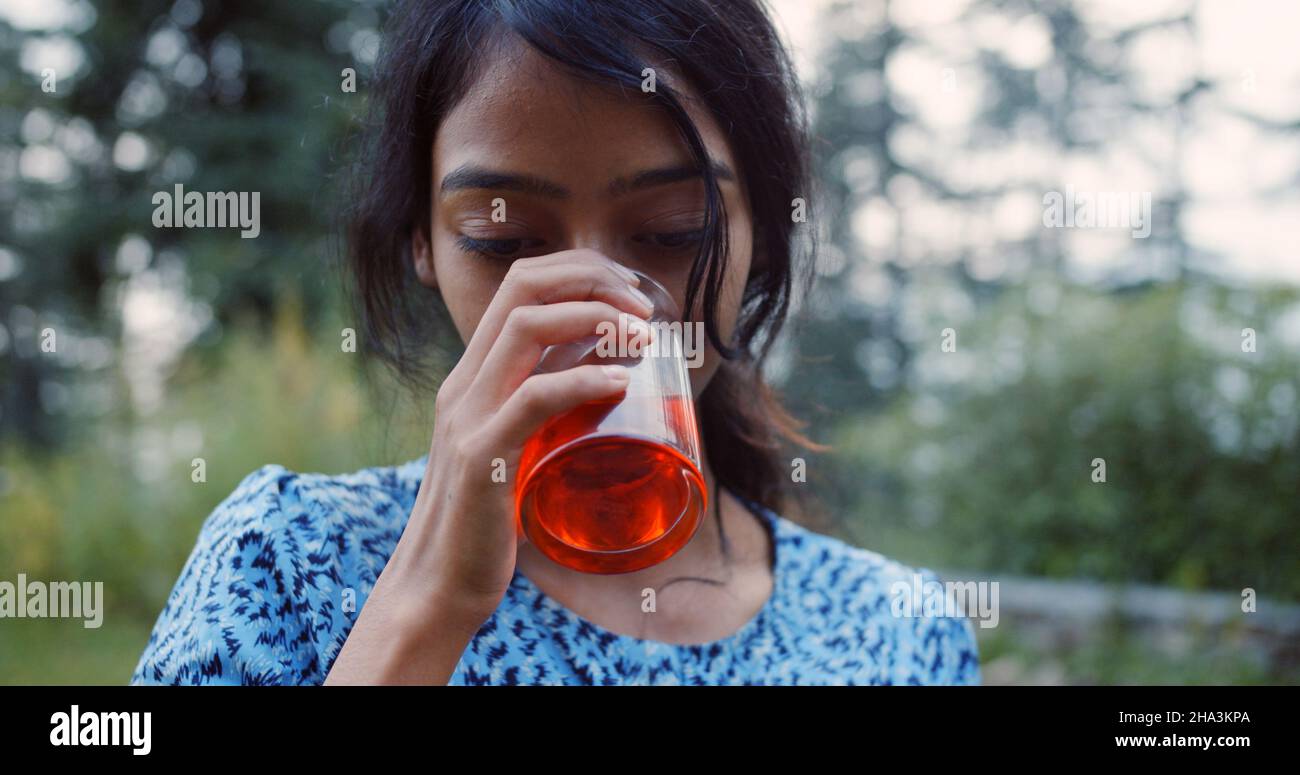 Closeup portrait of the young woman drinking a cocktail Stock Photo - Alamy