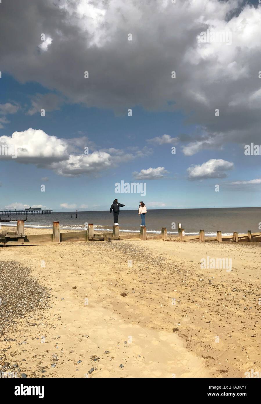 Two girls standing hi-res stock photography and images - Alamy