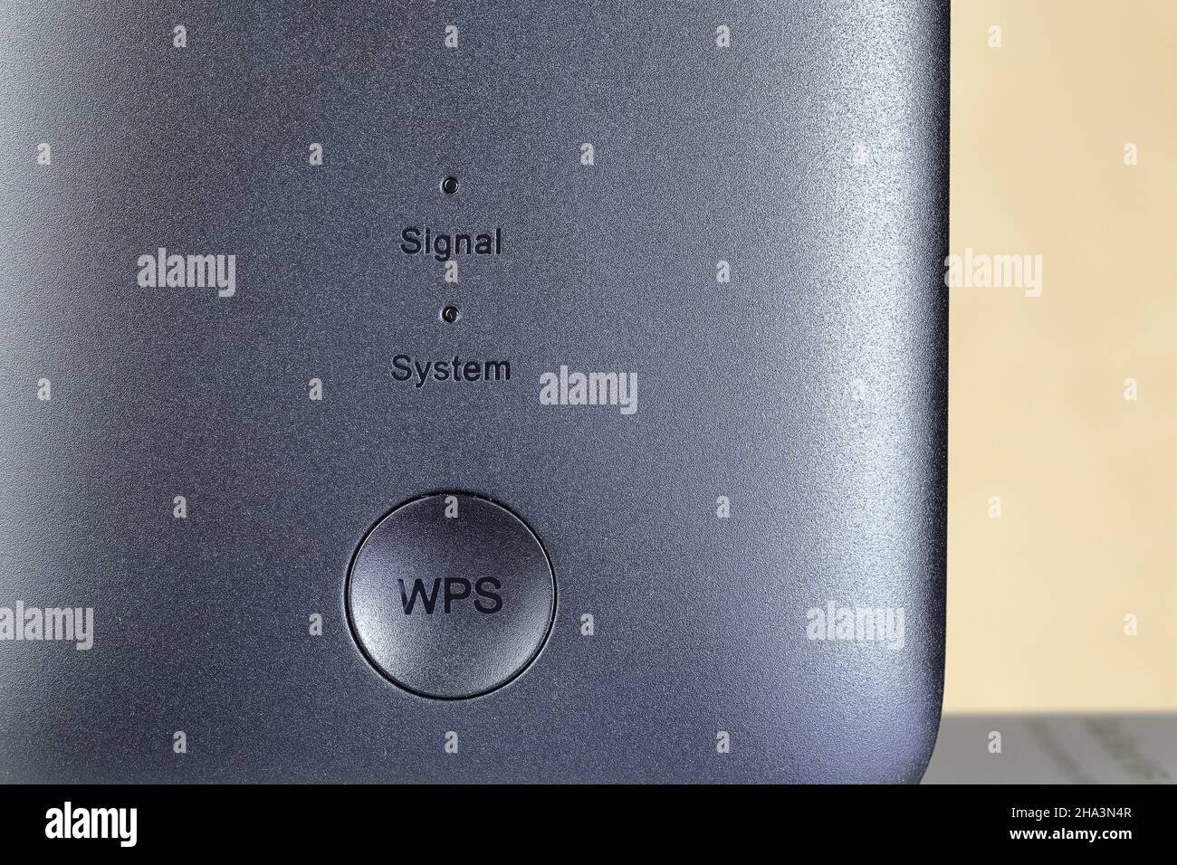 close-up with selective focus on WPS button and status lights on modern ...